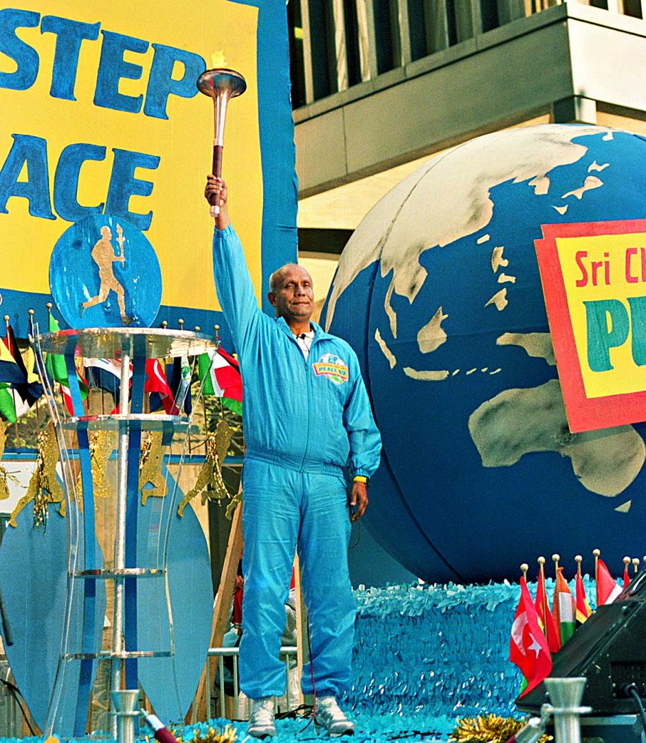 Sri Chinmoy holding the Peace Run Torch – SRI CHINMOY PHOTOS